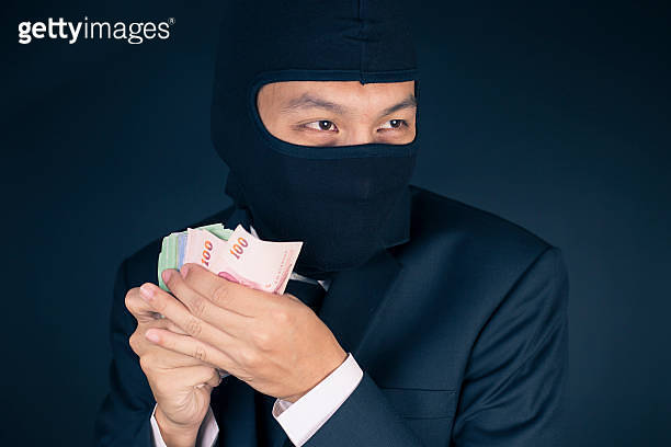 Businessman Wearing a Balaclava Thinking Corruption Plan and Sho ...