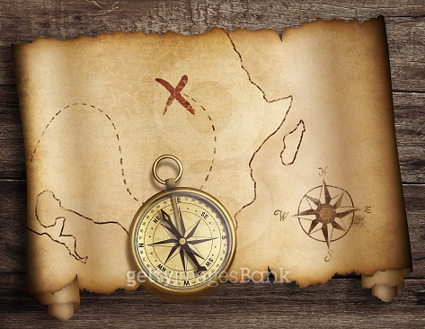 treasure map roll with old compass on table top view (521501748) - 게티이미지뱅크