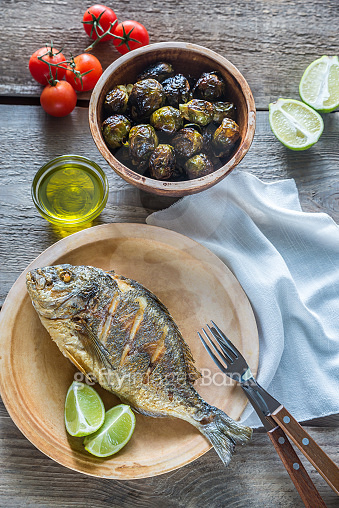 Grilled Dorade Royale Fish with fresh and baked vegetables (615713358 ...