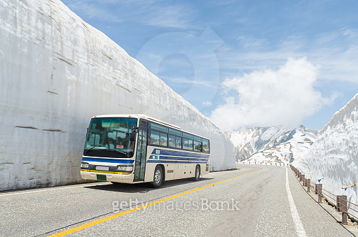 Blur windshield bus move along snow wall at japan alps tateyama kurobe ...