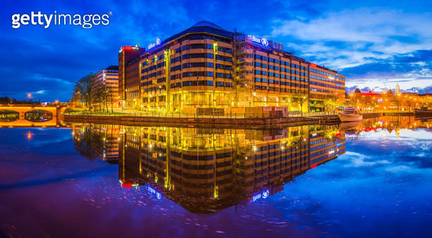 Helsinki illuminated city night across Kajsaniemiviken to Merihaka ...