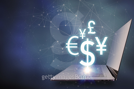 key currency symbols floating on laptop PC, financial technology ...