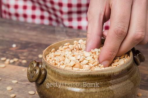 Dried peas broken up in the bowl on the table in the kitchen. Healthy ...