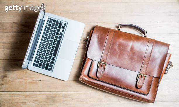 Laptop and Briefcase on a desk from above. 이미지 (664026154) - 게티이미지뱅크