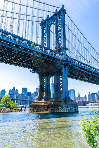 Manhattan Bridge Framing the World Trade Center in a sunny day ...