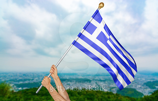 Young man's hands proudly waving the Greece national flag 이미지 ...