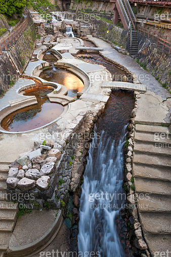 Hot spring stream flowing pass town centre of Arima Onsen in Kita-ku ...