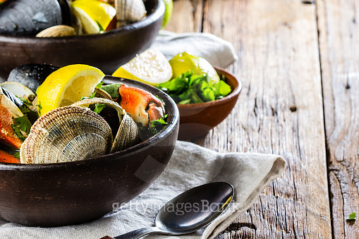 Seafood mussels, clams and crabs soup. Mariscal or paila marina served ...