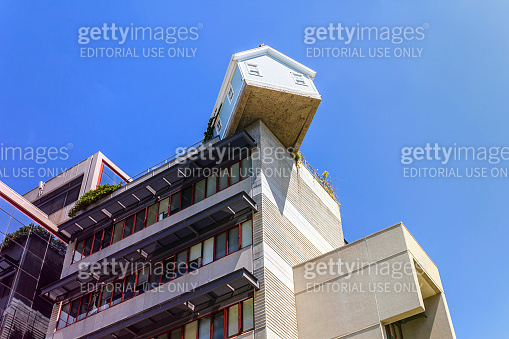 Fallen Star, an artwork by Do Ho Suh, is a skewed house on top of EBU ...