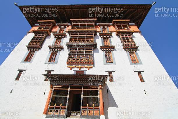 Traditional Bhutanese style building decorated with carved wood window ...