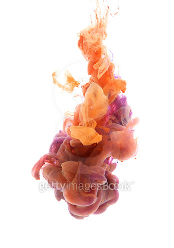 Colors dropped into liquid and photographed while in motion. Cloud of ...