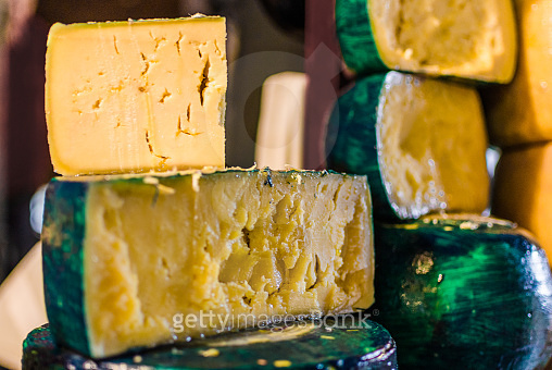 Selection of traditional Italian cheeses on a display, selective focus ...