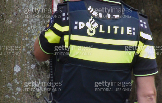 View Of Dutch Police Officer In Police Uniform Standing On The Street ...