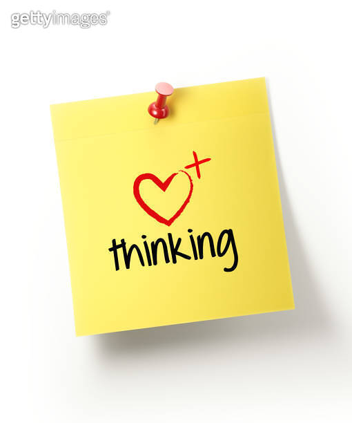 Yellow Sticky Note with Positive Thinking Message and Red Push Pin on ...