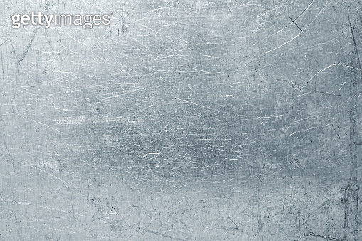 Worn steel sheet background, light metal texture with scratches and ...