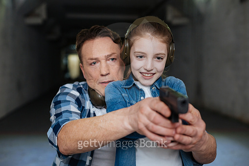 Nice handsome man directing his daughter 이미지 (664939766) - 게티이미지뱅크