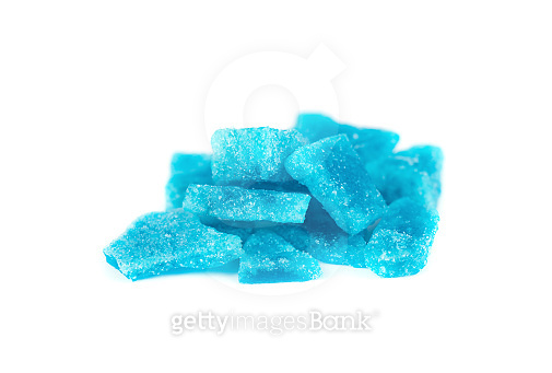 Blue crystal of methamphetamine isolated on white background. Blue ice ...