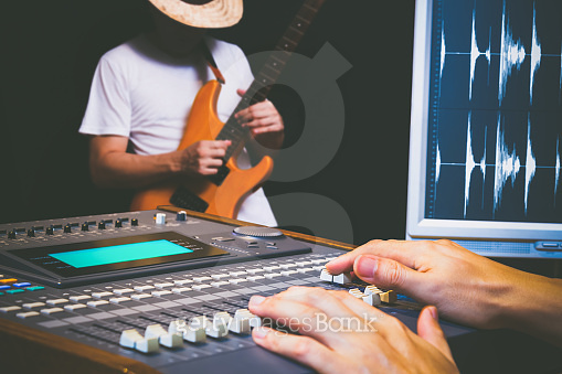 sound engineer hands working on digital sound mixer for electric guitar ...