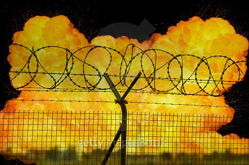 Realistic orange fire explosion behind restricted area barbed wire ...