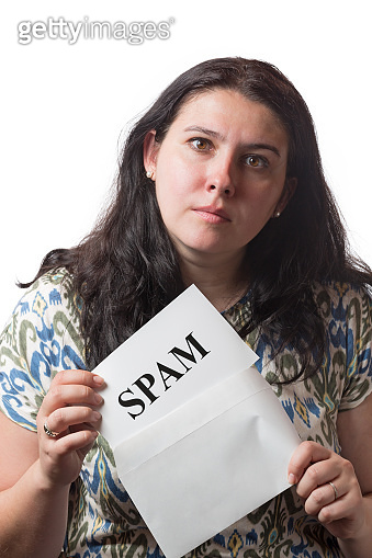 Sad woman is taking SPAM mail from envelope. isolated on white ...