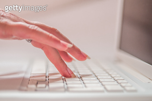 Fingers of woman pressing laptop keys 이미지 (833767970) - 게티이미지뱅크
