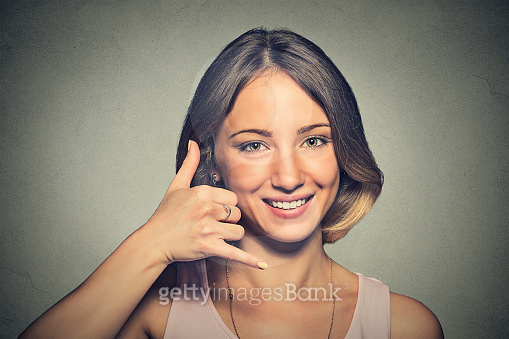 attractive young woman making showing call me sign and smiling 이미지 ...