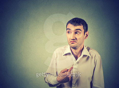 young guy pointing at himself you mean me? 이미지 (663127194) - 게티이미지뱅크