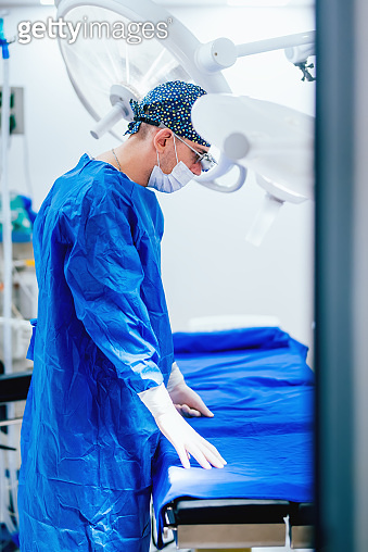 professional doctor, plastic surgeon getting ready for surgery and ...
