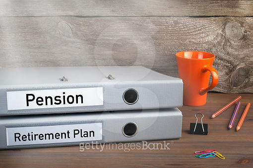 Retirement Plan and Pension - two folders on wooden office desk ...