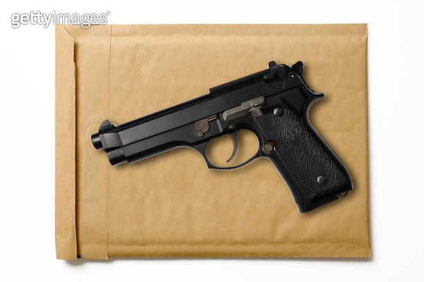 Black pistol with envelope on white background 이미지 (669445606) - 게티이미지뱅크