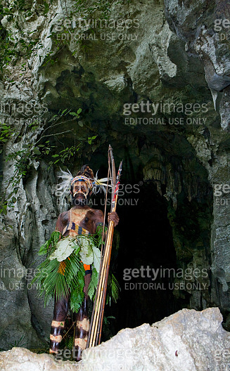 Warriors tribe Yaffi in war paint with bows and arrows in the cave. New ...