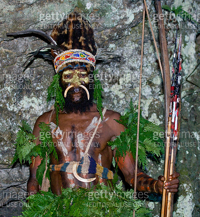 Warriors tribe Yaffi in war paint with bows and arrows in the cave. New ...
