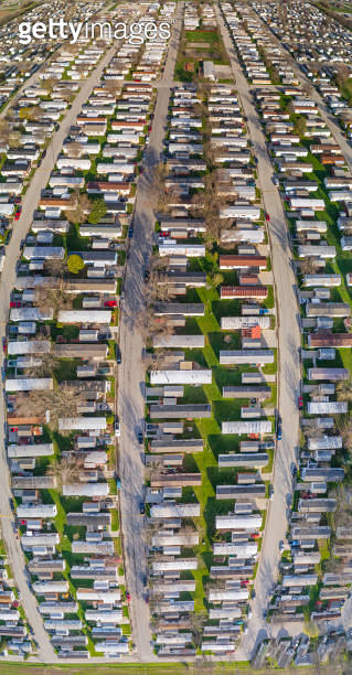 Aerial view looking down on vast trailer park, mobile homes. (675065658 ...