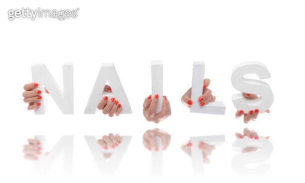 Hands holding up the word nails 이미지 (858575670) - 게티이미지뱅크