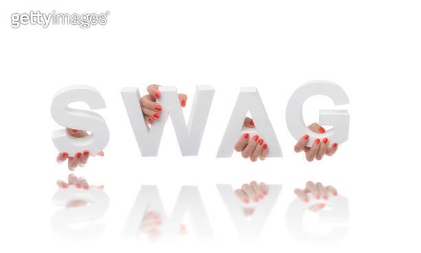 Hands holding up the positive word swag 이미지 (858575616) - 게티이미지뱅크