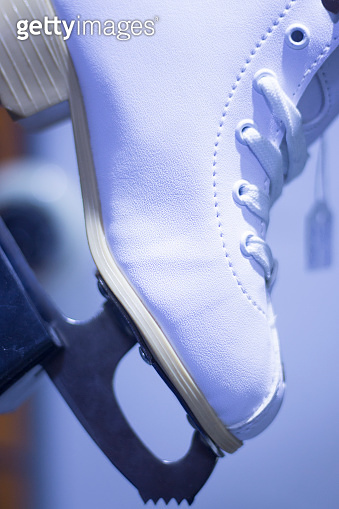 Ice skates in skate store shop window on display on sale for skating on ...