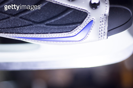 Ice skates in skate store shop window on display on sale for skating on ...