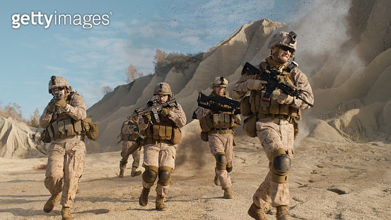 Squad of Fully Equipped, Armed Soldiers Running and Attacking During ...