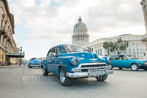Blue Chevrolet Classic Car Cruising Havana Cuba Past Capitolio Landmark ...