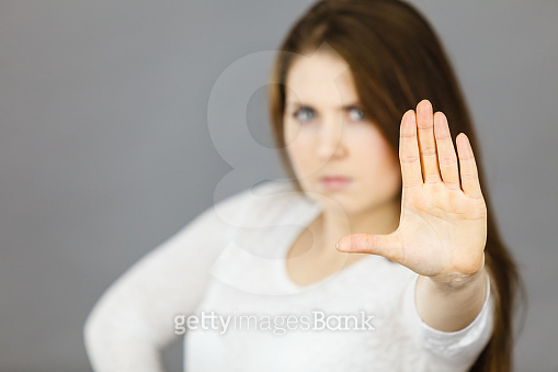 Angry apodicticity woman showing stop with hand (841102956) - 게티이미지뱅크