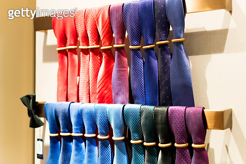 neckties showcase at store. Collection of coiled neckties in display ...