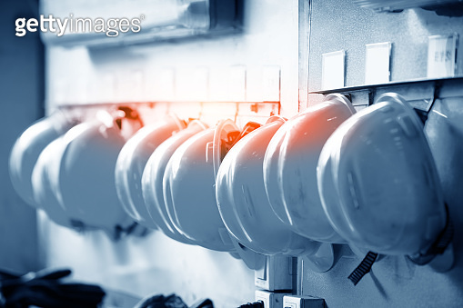dirty construction safety helmet hanging on the wall.safety conceptual ...