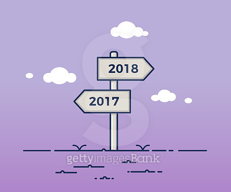 Signpost pointing towards two opposite directions between 2017 and 2018 ...