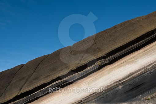 stratified, striped rocks , colored stone sediment (645693380) - 게티이미지뱅크
