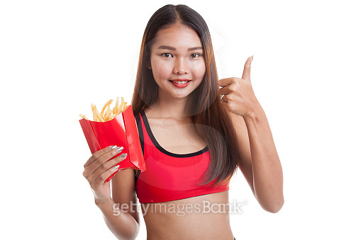 Asian healthy girl eat french fries show thumbs up. 이미지 (638500288 ...