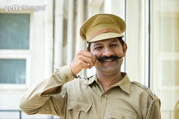 Police officer holding his mustache 이미지 (988392010) - 게티이미지뱅크