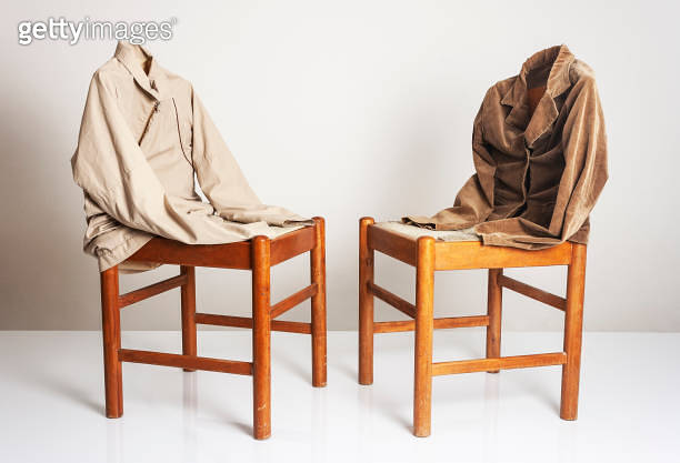 Jackets over chairs 이미지 (1019079414) - 게티이미지뱅크