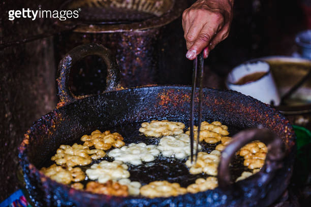 Indian Nepali Sweet Food Jeri or Jilebi cooking with hand ,A hand ...