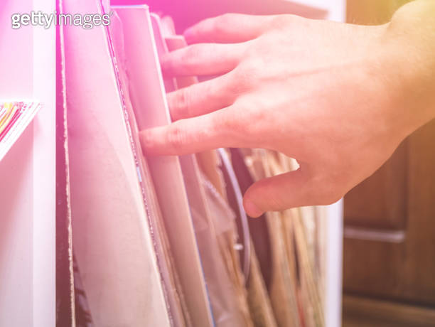crate digging collection, person hand picking the music vinyl record at ...