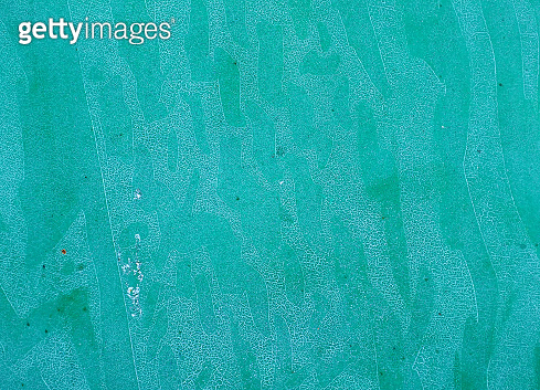 closeup old rustic green metal texture, dry stain and cracks on surface ...